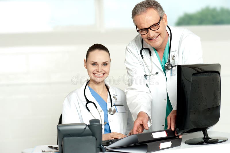 Two Cheerful Doctors at Hospital Stock Image - Image of elegant ...