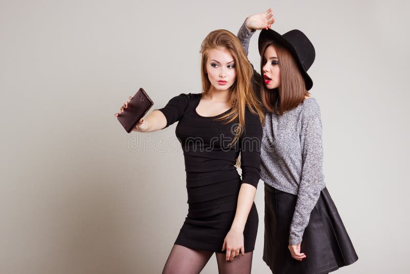 Two Cheerful Happy Girl Girlfriends Photographed On The Phone Self