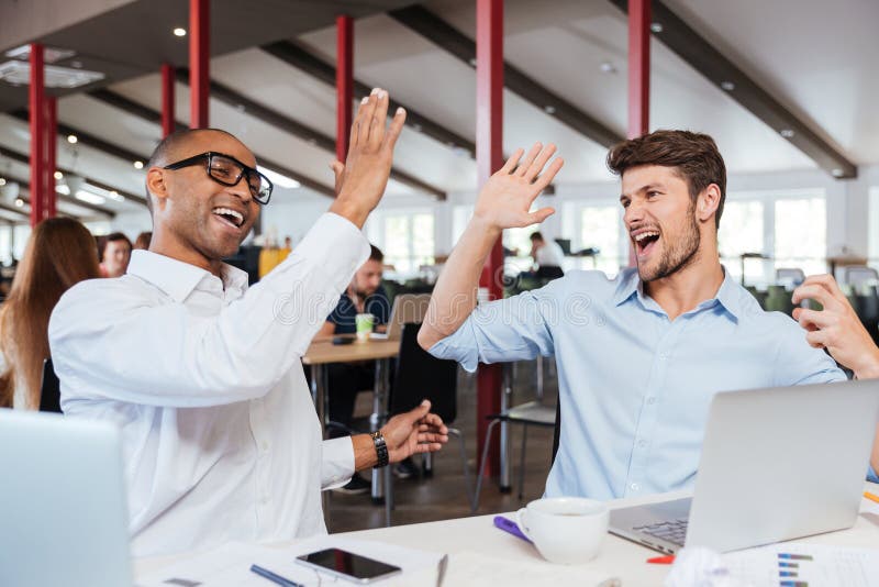 Two Cheerful Men Giving High Five and Working in Office Stock Image ...