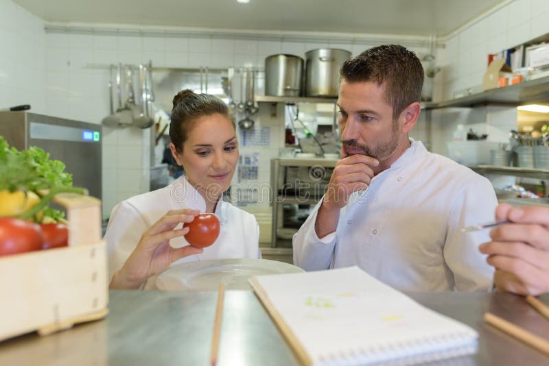 Two Chefs in Commercial Kitchen Stock Image - Image of cheerful, black ...