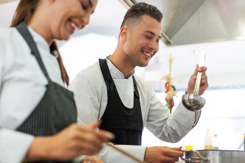 Two chefs in kitchen stock photo. Image of male, confident - 95289316
