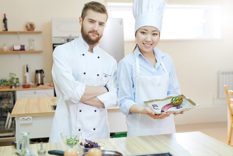 Handsome Chef Posing in Kitchen Stock Photo - Image of looking, camera ...