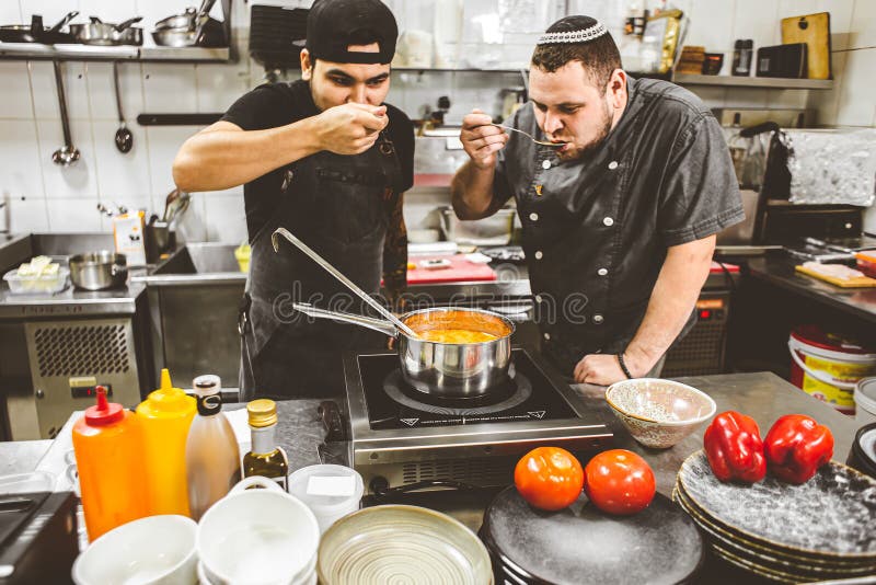 Two Chefs in the Restaurant Kitchen are Trying Food. Training Stock ...