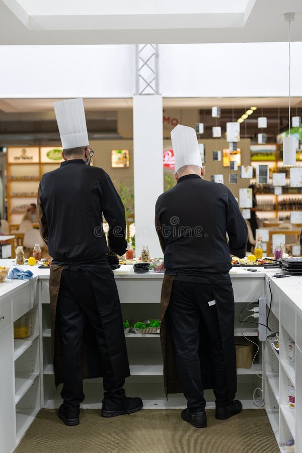 Two Chefs Seen from Behind: Serving Diners Behind Their Table Editorial ...