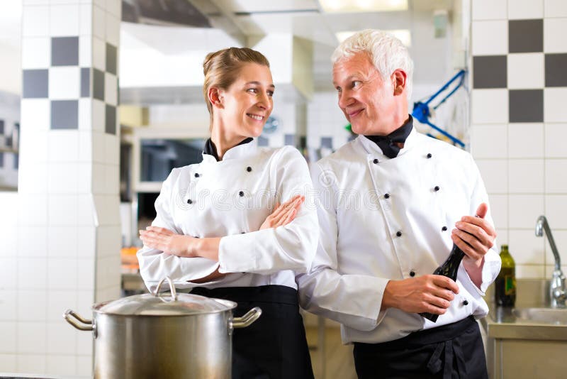 Two Chefs in Team in Hotel or Restaurant Kitchen Stock Image - Image of ...