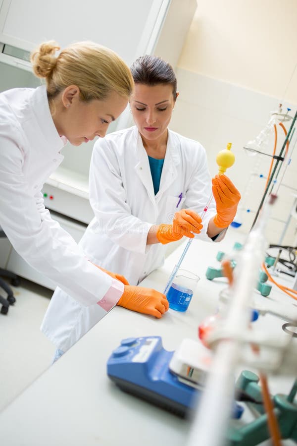 Two Chemical Technician Place Liquid with Lab Pipette Stock Photo ...