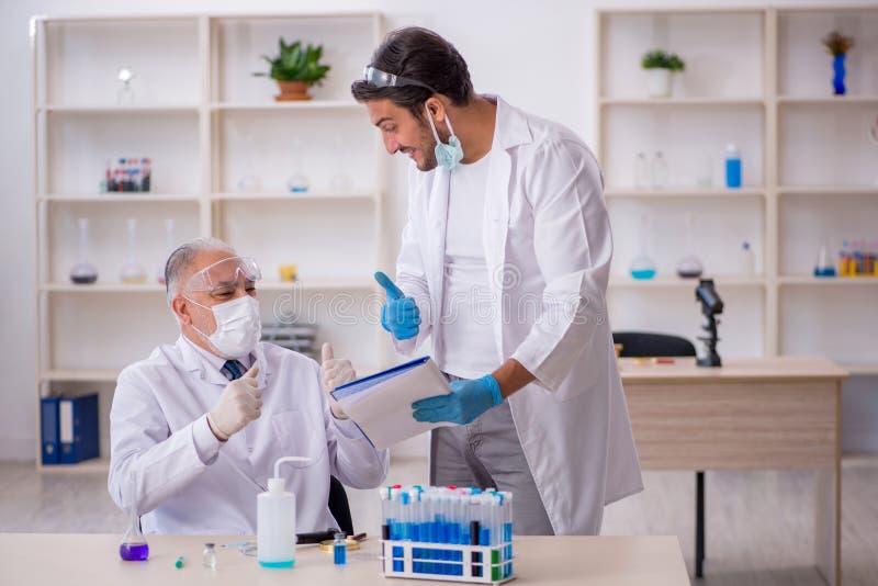 Two Male Chemist Working at the Lab Stock Image - Image of chemical ...