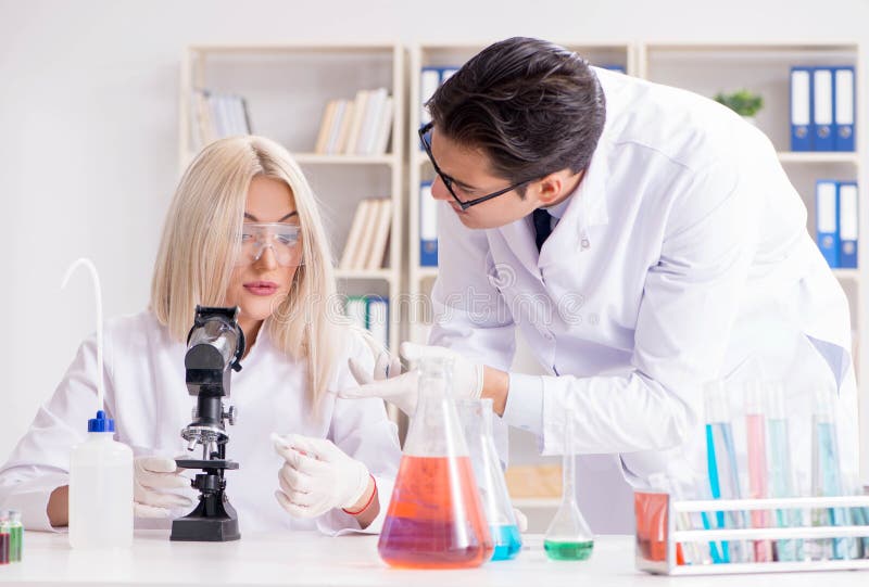 Two Chemists Having Discussion in Lab Stock Image - Image of glass ...