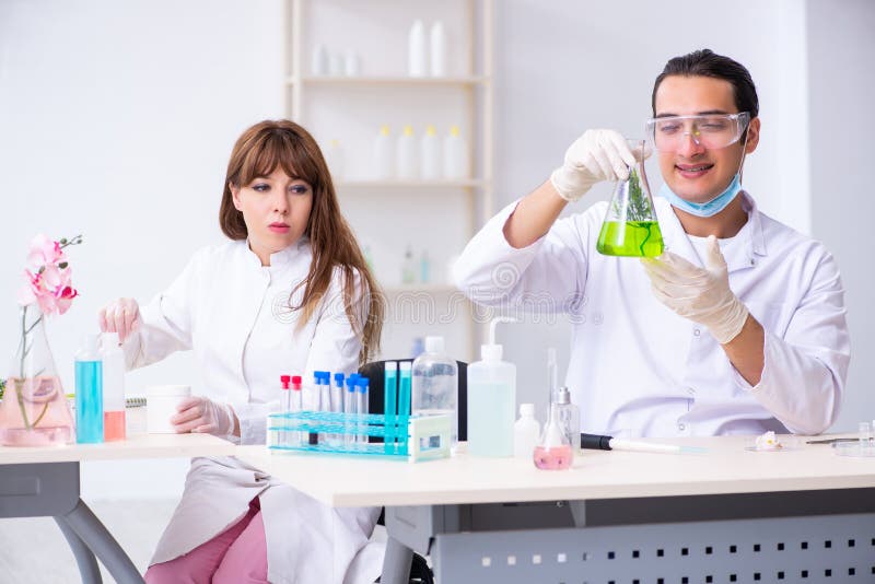Two Chemists Working in the Lab Stock Image - Image of analyzing, aroma ...