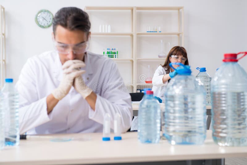 Two Chemists Working in the Lab Stock Photo - Image of chemist ...