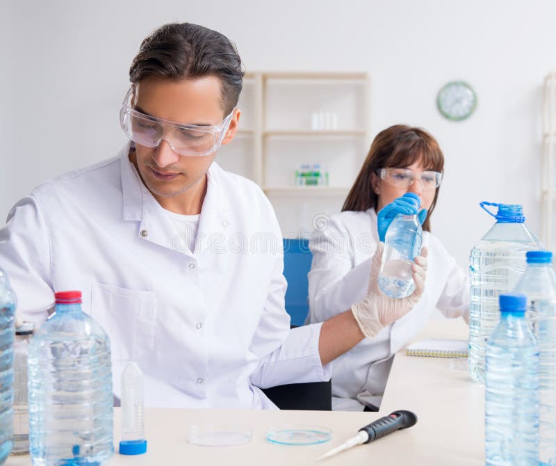 Two Chemists Working in the Lab Stock Photo - Image of medicine, fresh ...