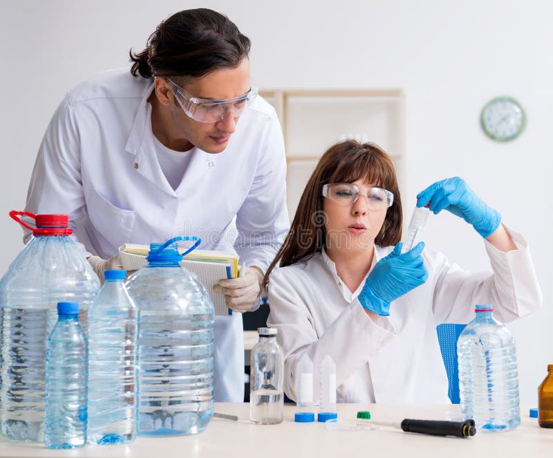 Two Chemists Working in the Lab Stock Image - Image of health, notes ...