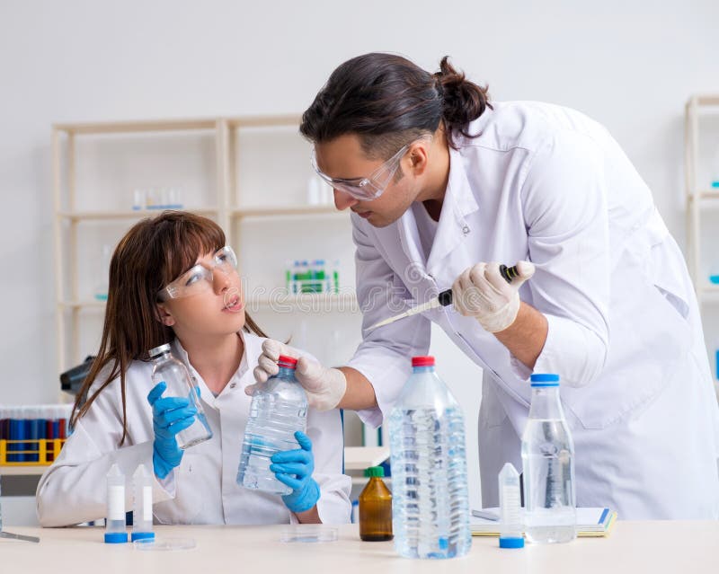 Two Chemists Working in the Lab Stock Photo - Image of control ...