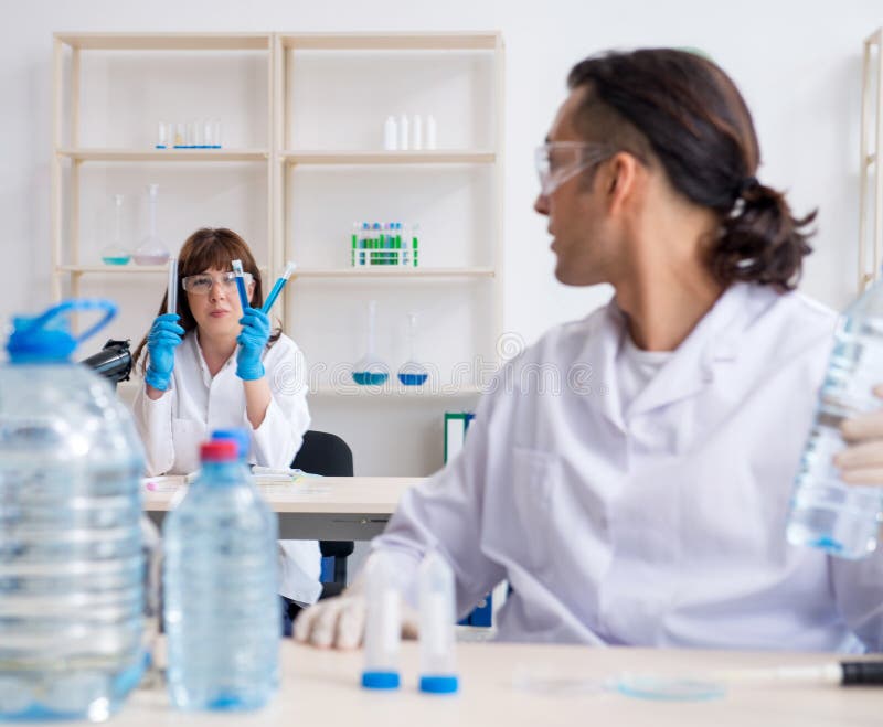 Two Chemists Working in the Lab Stock Image - Image of biotechnology ... Two Chemists Working in the Lab Stock Image - Image of biotechnology ...