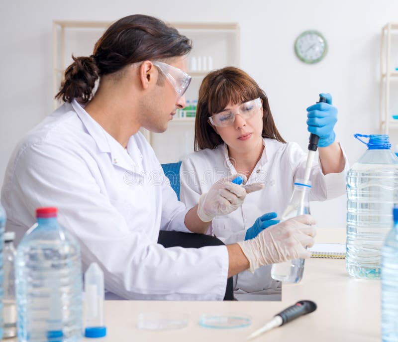 Two Chemists Working in the Lab Stock Image - Image of fresh, clean ...