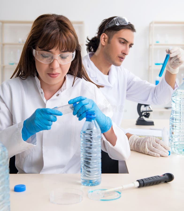 Two Chemists Working in the Lab Stock Image - Image of chemistry ...