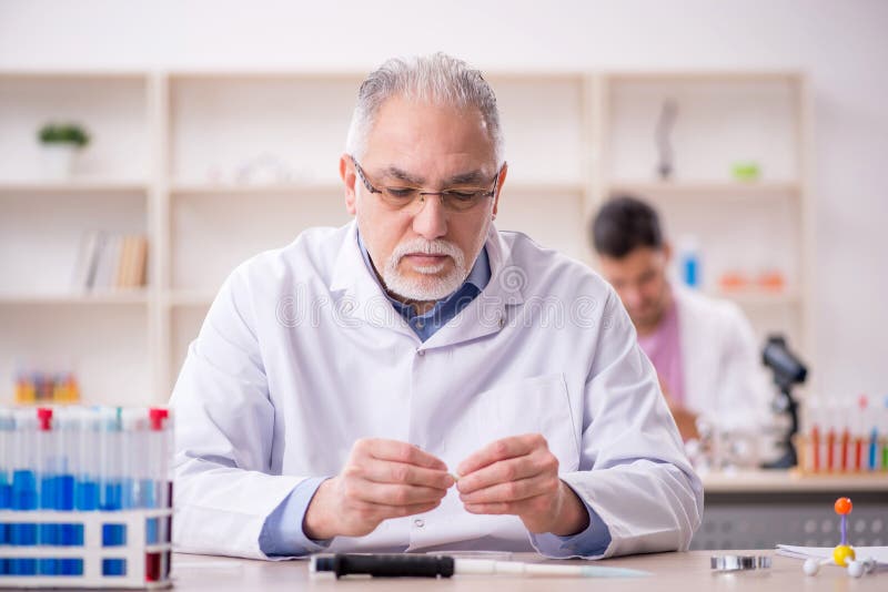 Two Male Chemists Working at the Lab Stock Photo - Image of young ...