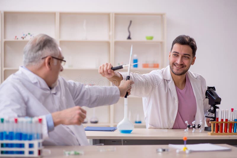 Two Male Chemists Working at the Lab Stock Photo - Image of student ...