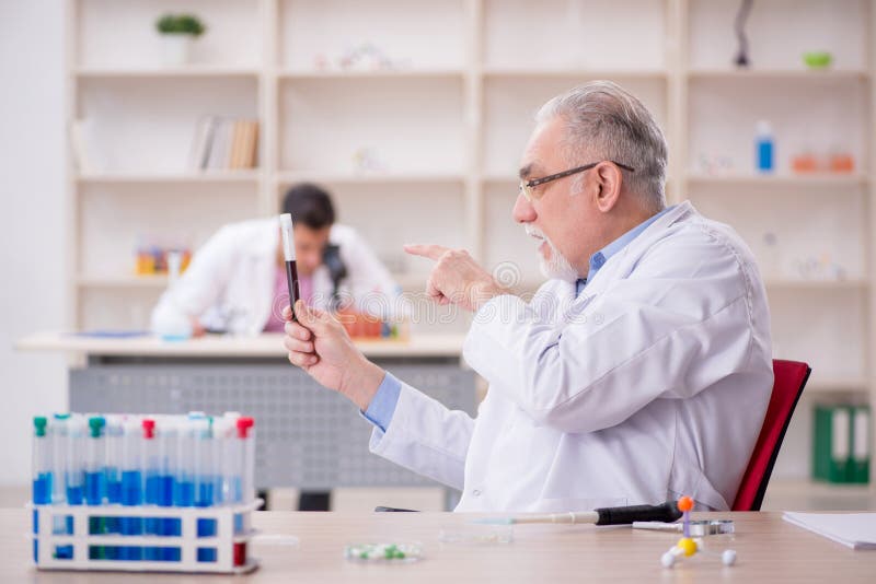 Two Male Chemists Working at the Lab Stock Photo - Image of looking ...
