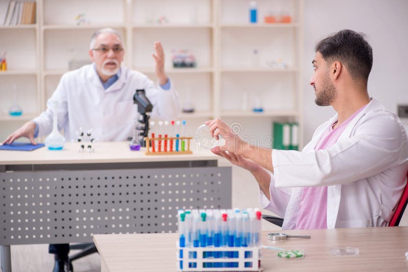 Two Male Chemists Working at the Lab Stock Image - Image of analyzing ...
