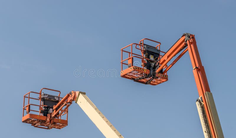 Two Cherry Picker Machines stock image. Image of outdoor - 114796091