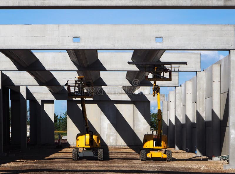 Two Cherry Pickers in a Construction Building Stock Photo - Image of ...