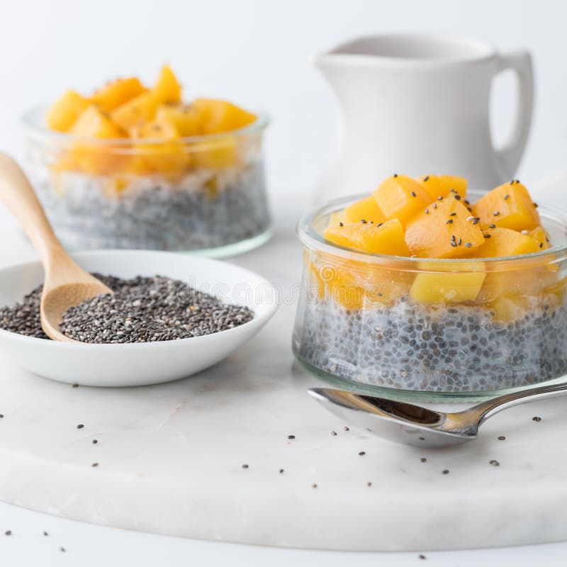 Two Chia Pudding Parfaits Topped with Diced Mangos and a Bowl of Chia ...
