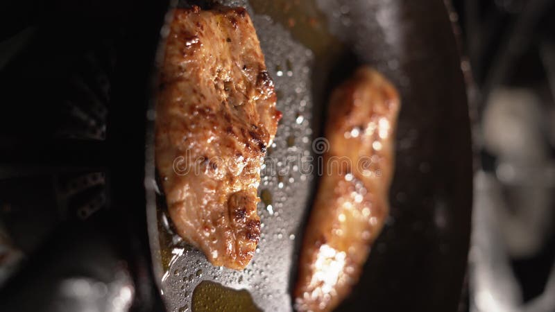 Two Chicken Breasts Fried in a Pan. the Process of Cooking Chicken Meat ...
