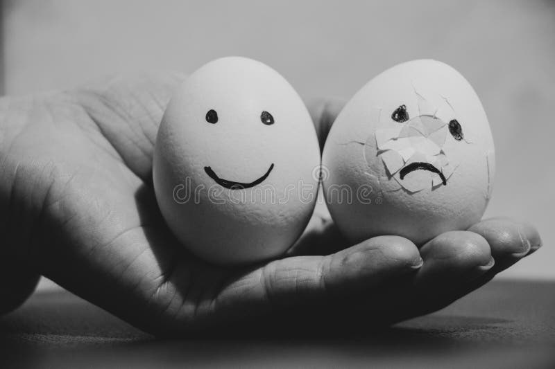 Two Chicken Eggs, One with Joy and the Second Broken with Sad Emotion ...