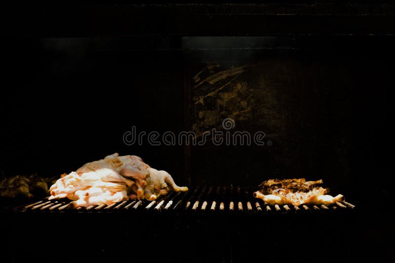 Two Chickens on Top of an Oven Grill in the Dark Stock Image - Image of ...