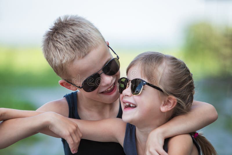 Two Children in Black Sunglasses Having Fun Time Outdoors in Summer ...