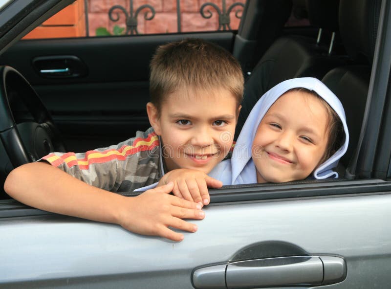 Two children in the car stock image. Image of security - 17261341