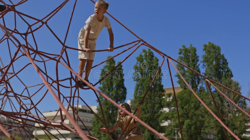 Children Climbing Rope Structure at Playground Stock Footage - Video of ...