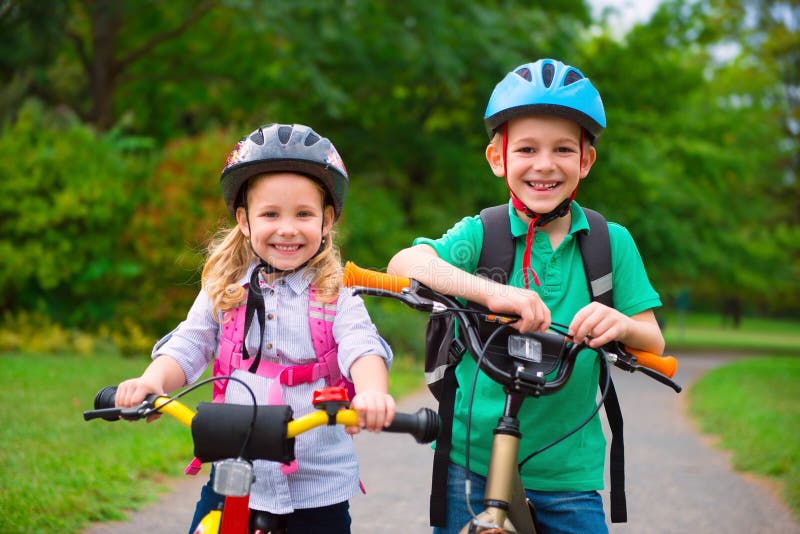 Two Children Cycling in Park Stock Image - Image of active, brother ...