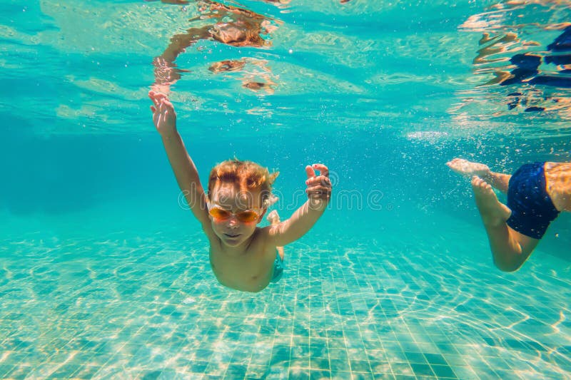 Two Children Diving in Masks Underwater in Pool Stock Image - Image of ...