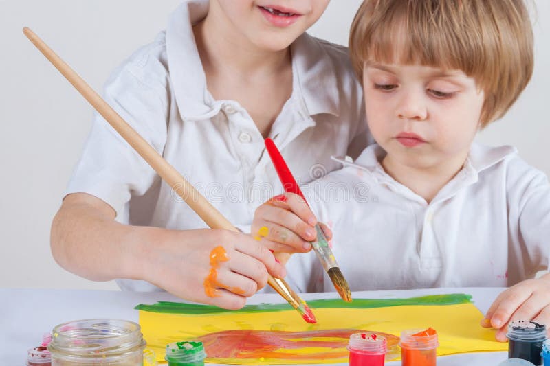 Two Children Draw Together. they Paint in Different Colors Stock Image ...