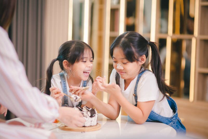 Two Children Eat a Fresh Cake Together for Their Birthday Stock Photo ...
