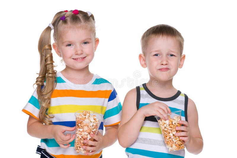 Two children eat popcorn stock photo. Image of gourmet - 51137912