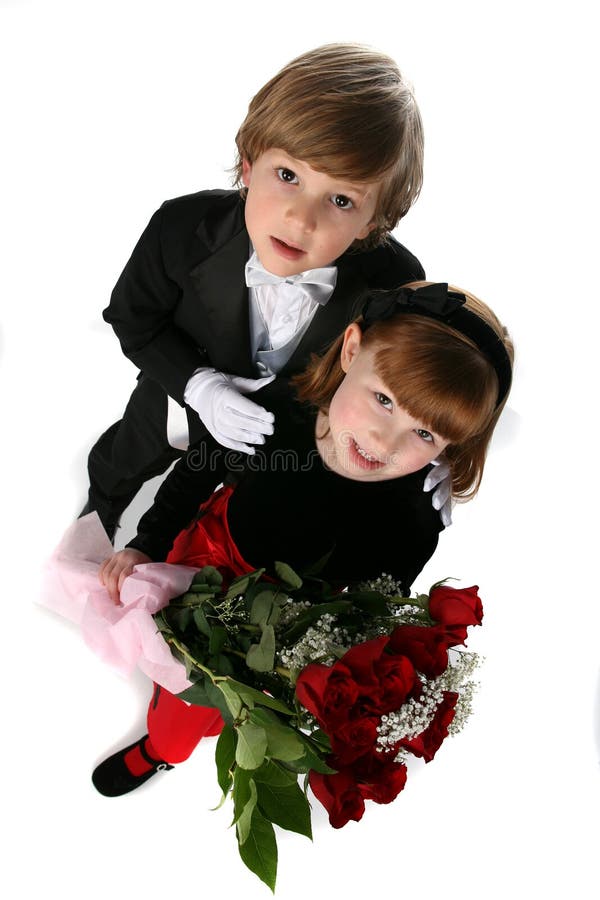 Two Children in Formal Clothing and Red Roses Stock Photo - Image of ...