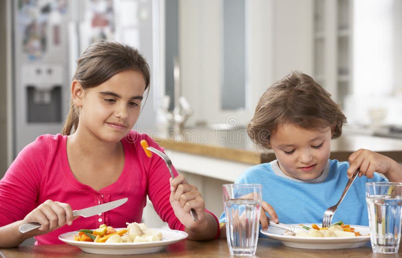 Two Children Having Meal in Kitchen Together Stock Photo - Image of ...