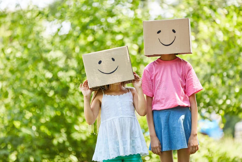 Children Hide Faces Under Cardboard Boxes Stock Image - Image of ...