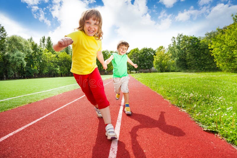 Two Children Holding Hands Running Together Stock Photo - Image of cute ...