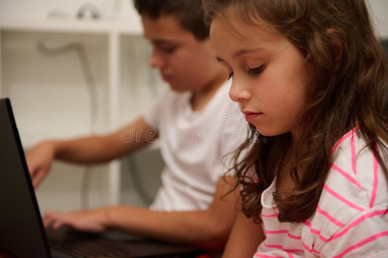 Focused Children Using Laptops for Online Learning at Home Stock Image ...