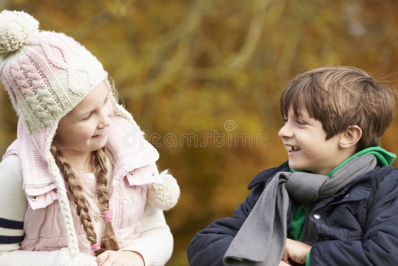 Two Children Leaning Over Wooden Fence Talking Stock Photo - Image of ...