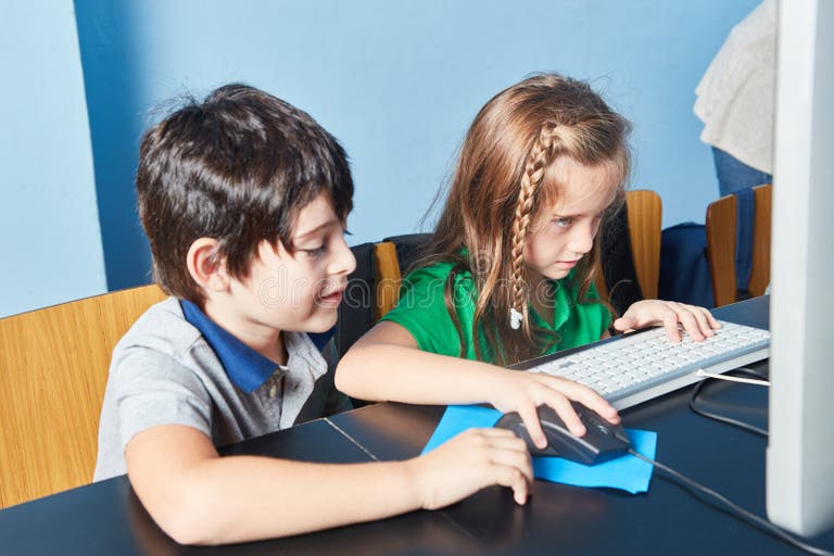 Two Children Learn Concentrated at the Computer Stock Image - Image of ...