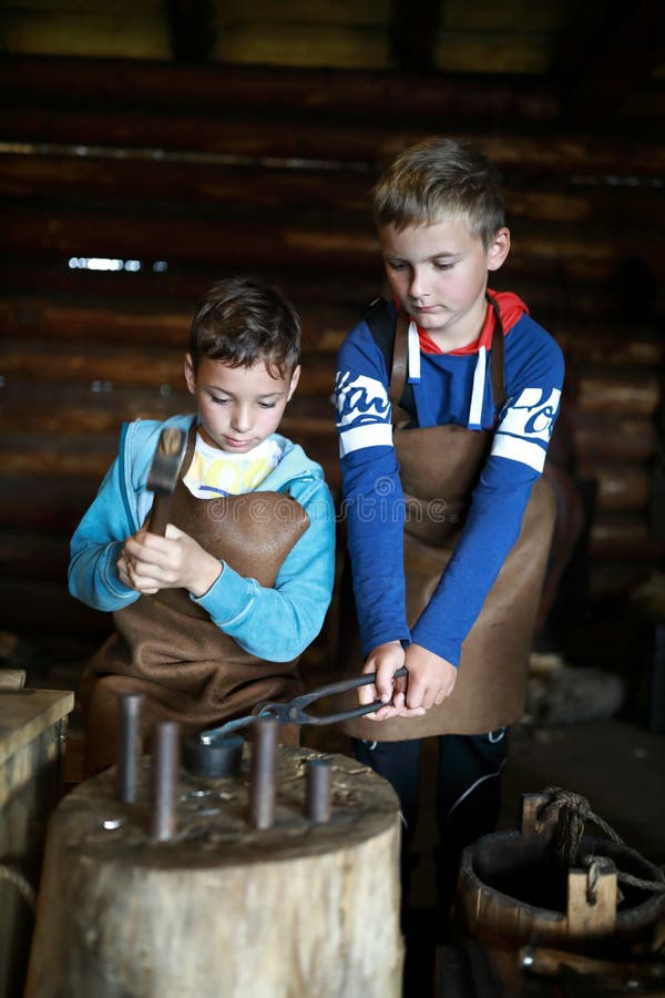 Children Make Coin in Forge Stock Image - Image of blacksmith, male ...