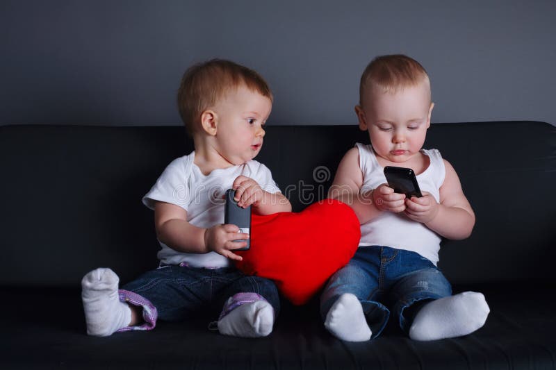 Two Children with Mobile Phones on Date Stock Photo - Image of concept ...