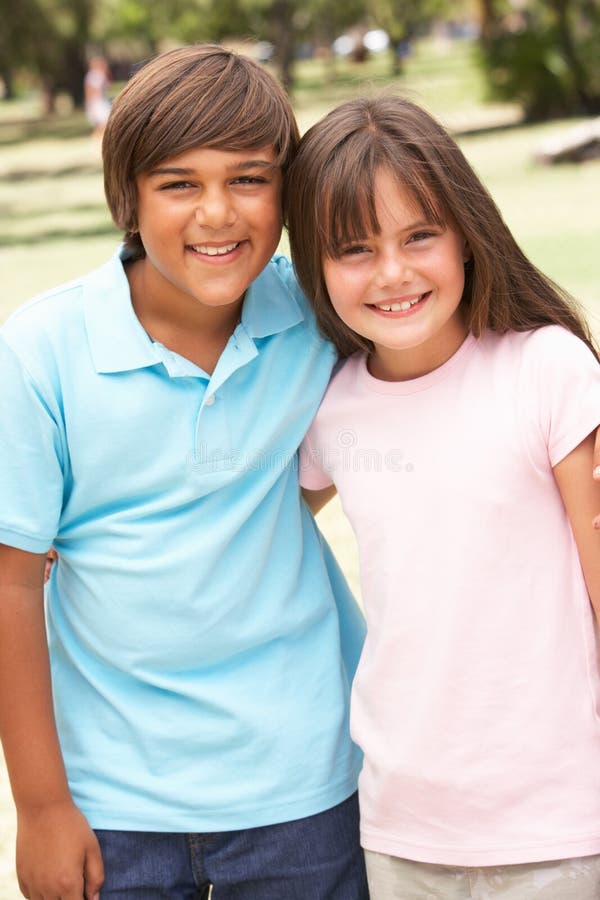 Two Children in Park Giving Each Other Hug Stock Photo - Image of mates ...