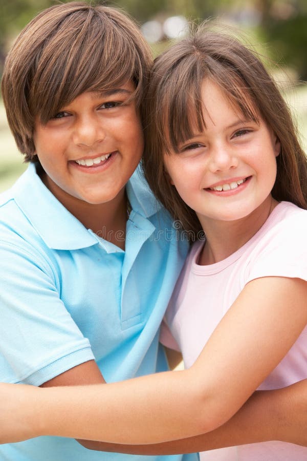 Two Children in Park Giving Each Other Hug Stock Photo - Image of copy ...