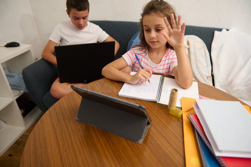 Children Engaged in Remote Learning Using Tablet and Laptop at Home ...